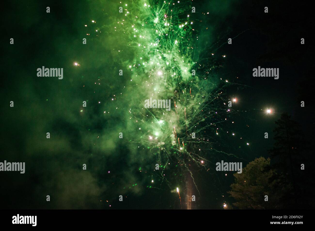 Green fireworks in the night sky Stock Photo - Alamy