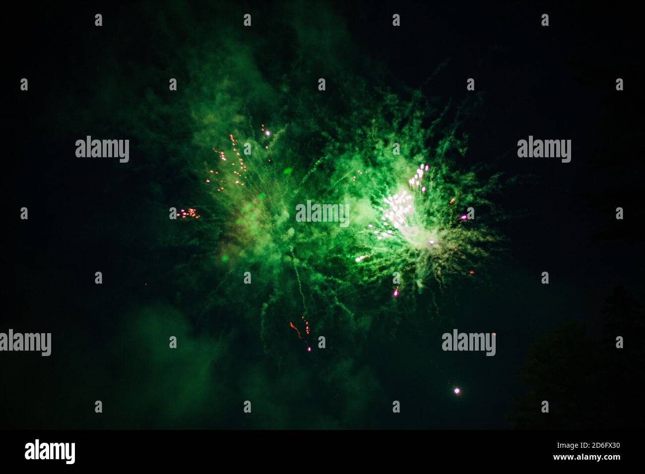 Bright green fireworks in the night sky Stock Photo - Alamy