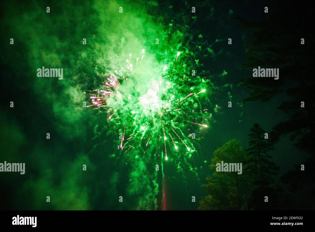 Bright green fireworks in the night sky Stock Photo - Alamy