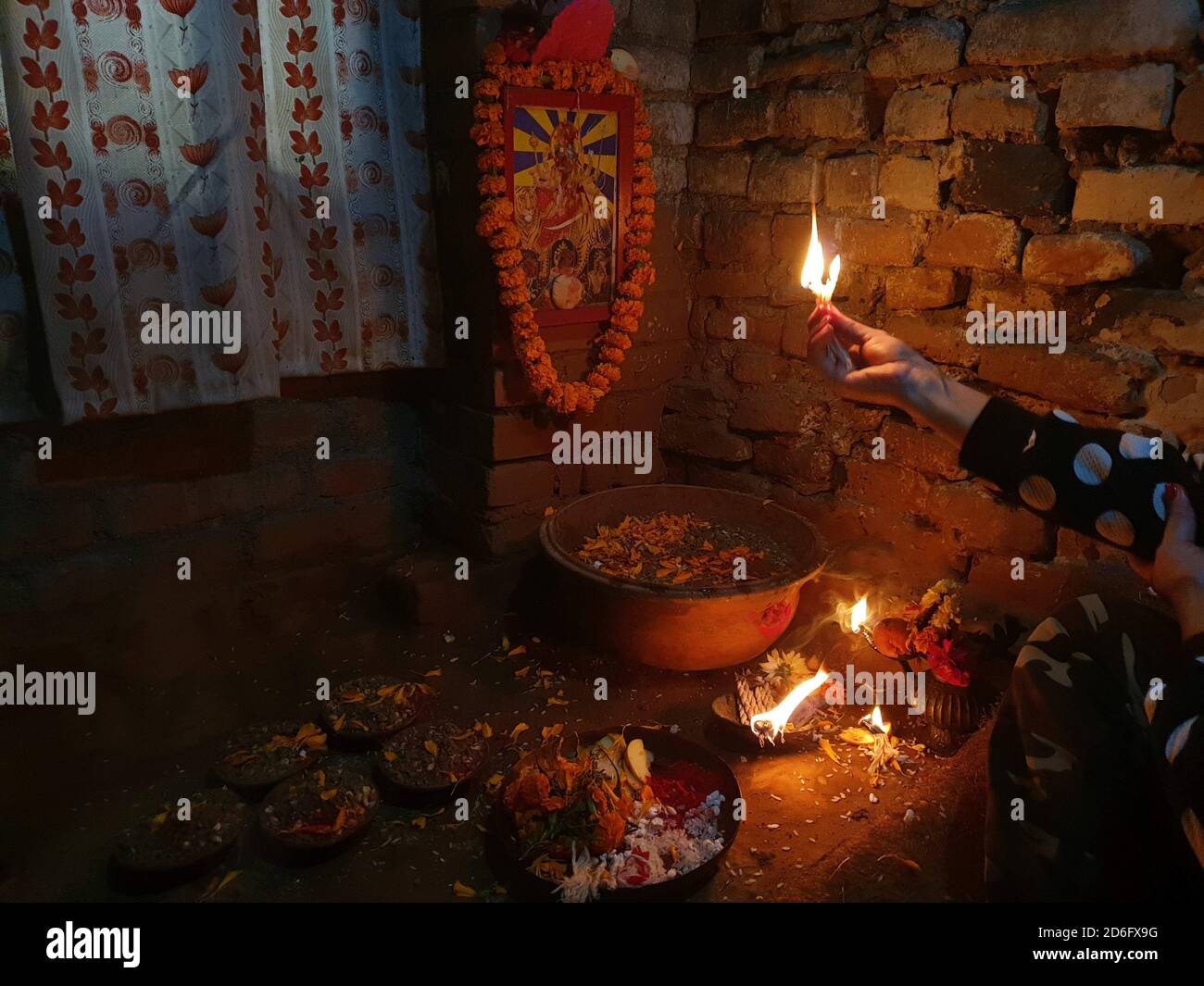 Kathmandu, Nepal. 17th Oct, 2020. A Nepali woman offers prayers after ...