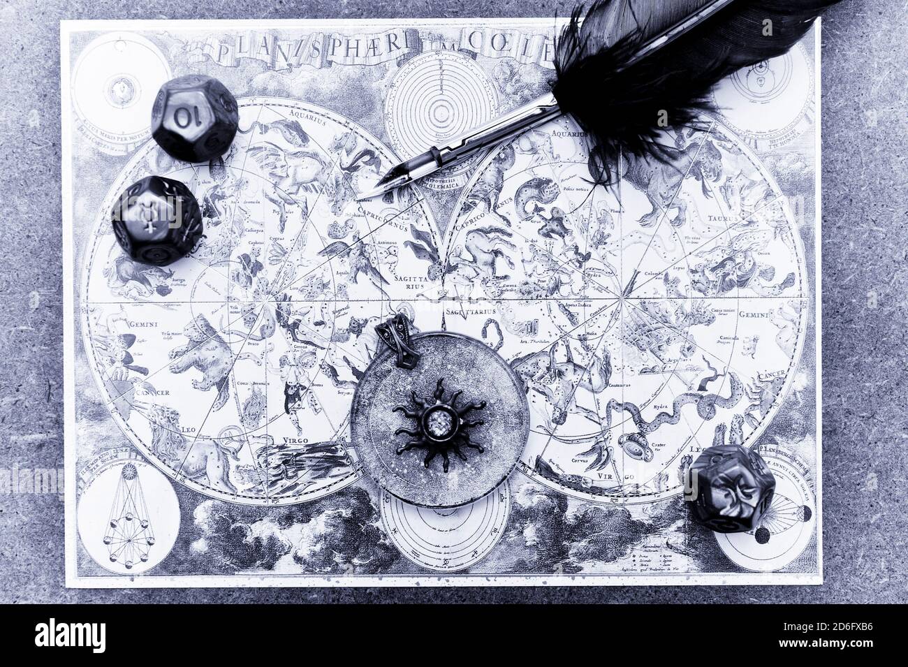 antique astrology chart with zodiac signs and dice with a quill pen ...