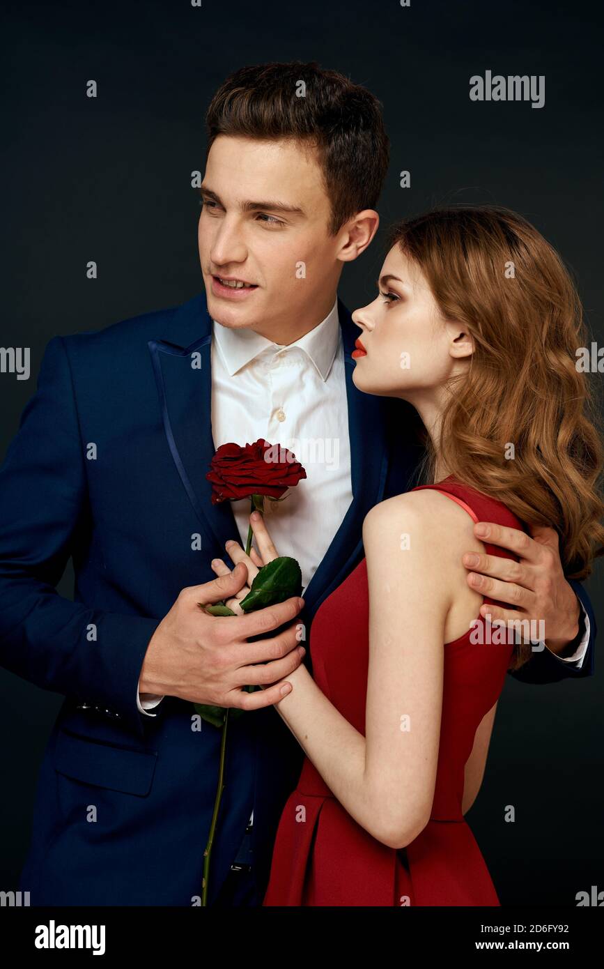 luxury couple hug romance relationship rose over dark isolated ...