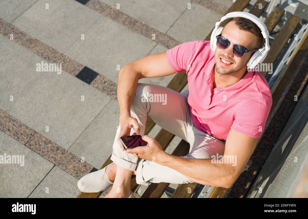 Handsome guy on bench Stock Photo - Alamy