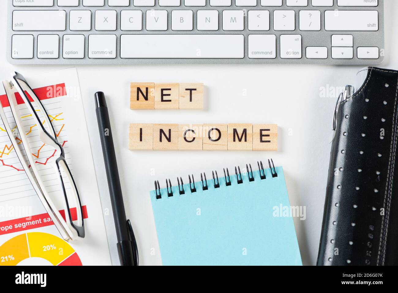 Net income concept with letters on cubes Stock Photo - Alamy