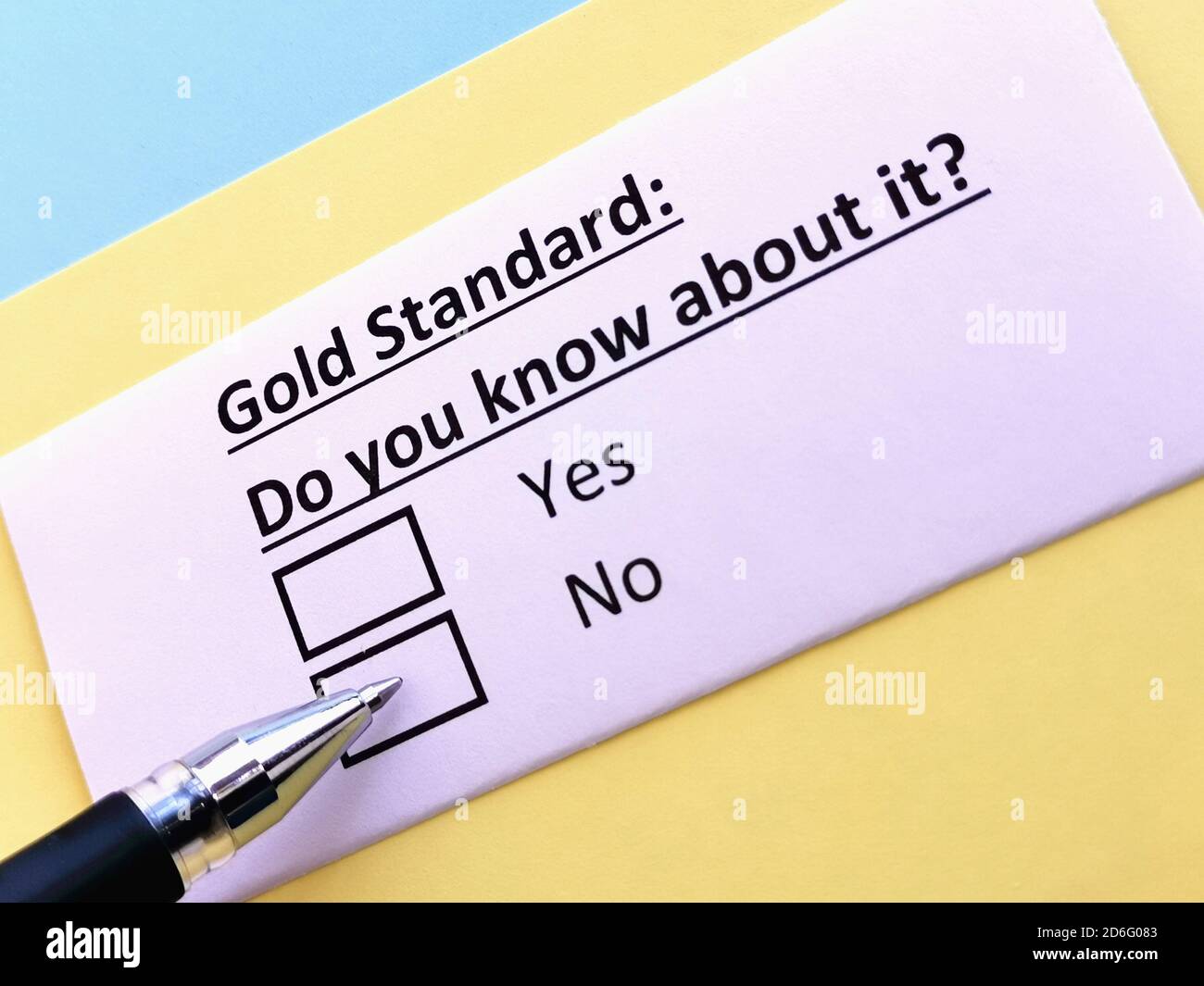 One person is answering quetion about gold standard Stock Photo - Alamy