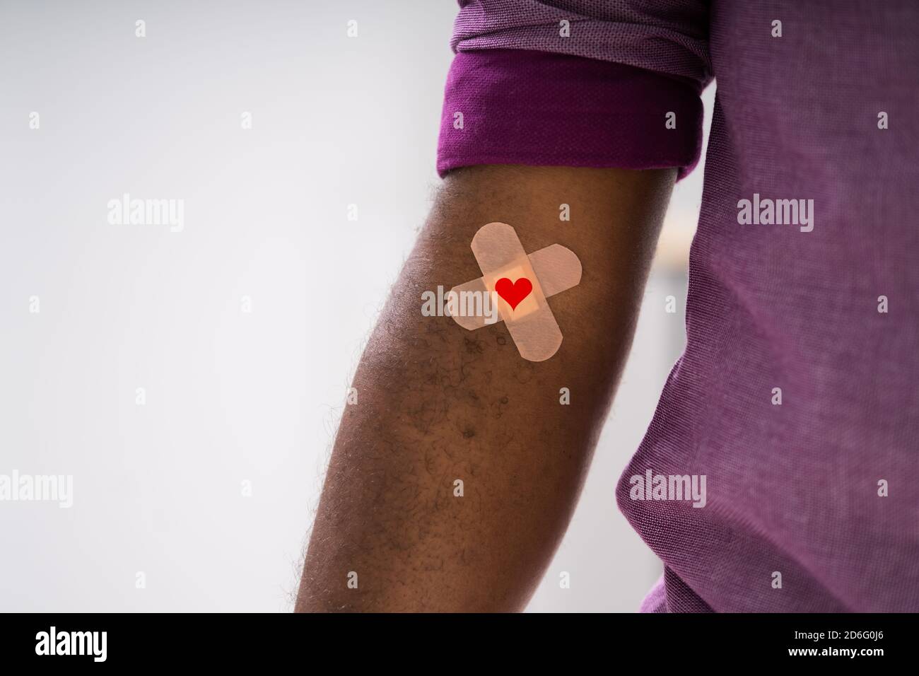 Blood Donation Concept. African American Donor With Band Aid And Heart ...
