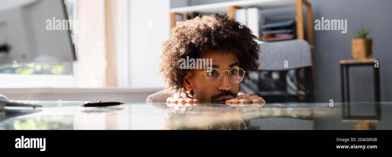 Sneaky office hi-res stock photography and images - Alamy