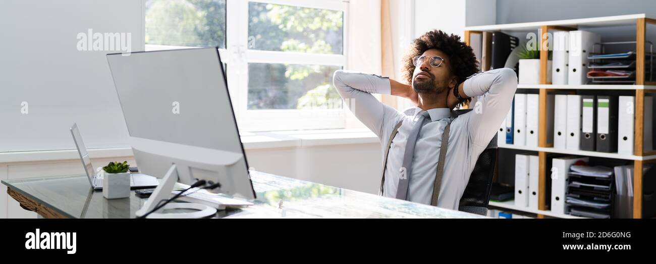 Successful African Businessman Leaning Back. Happy Employee Stock Photo ...