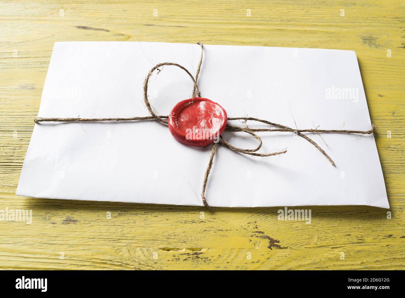 Letter with seal on table Stock Photo - Alamy