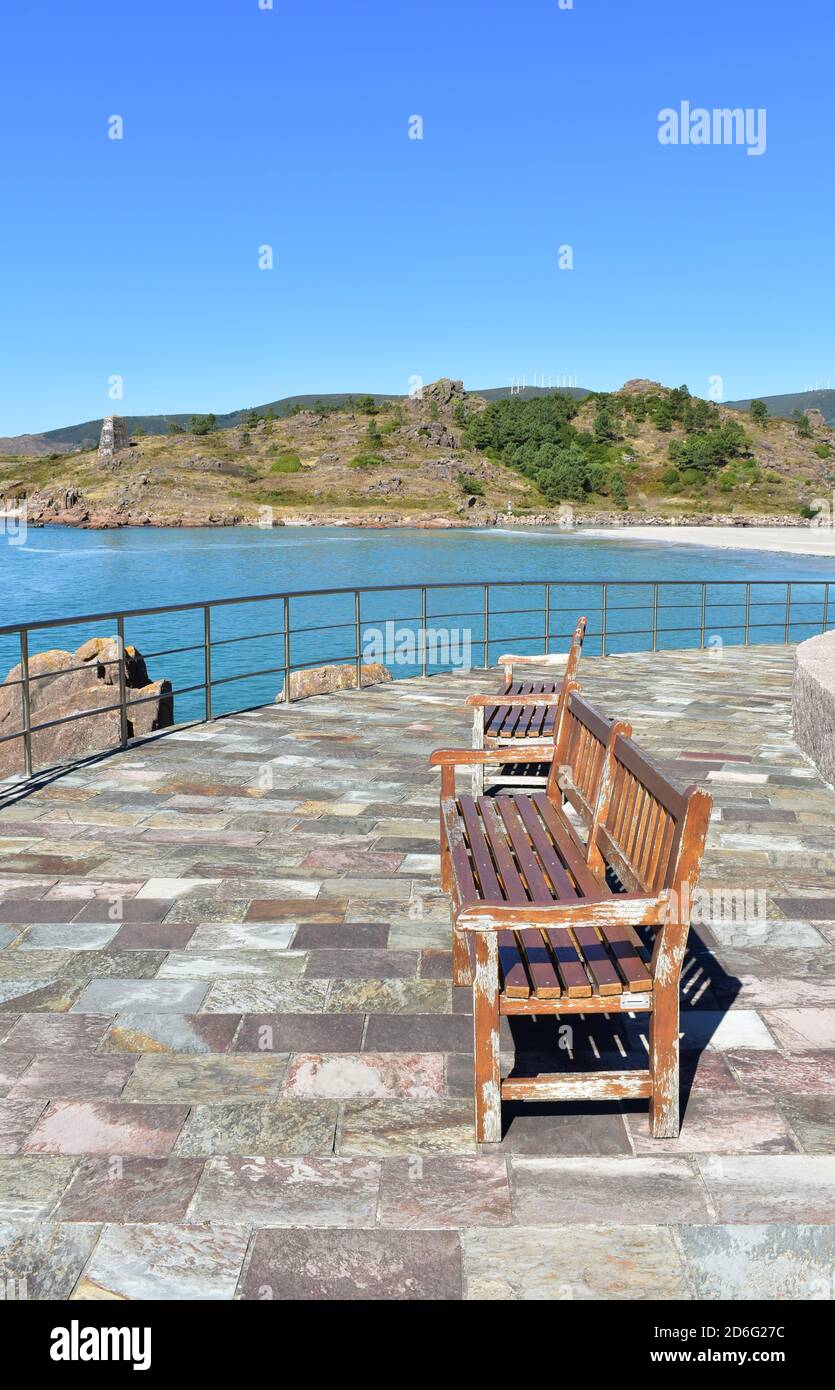 Beach promenade with wooden benches. Playa de San Pedro (Playa de O ...