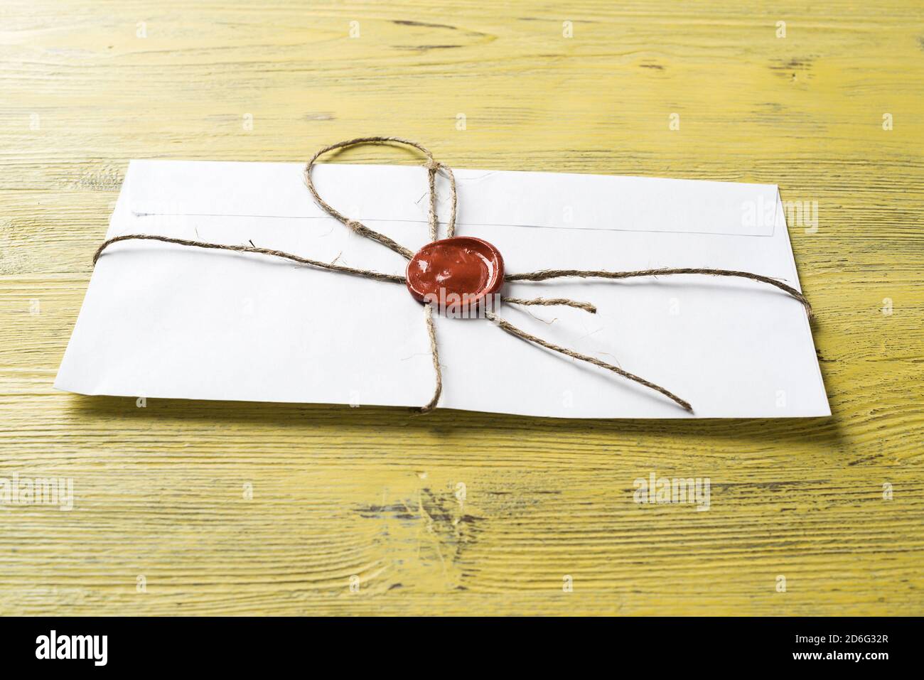 Letter with seal on table Stock Photo - Alamy