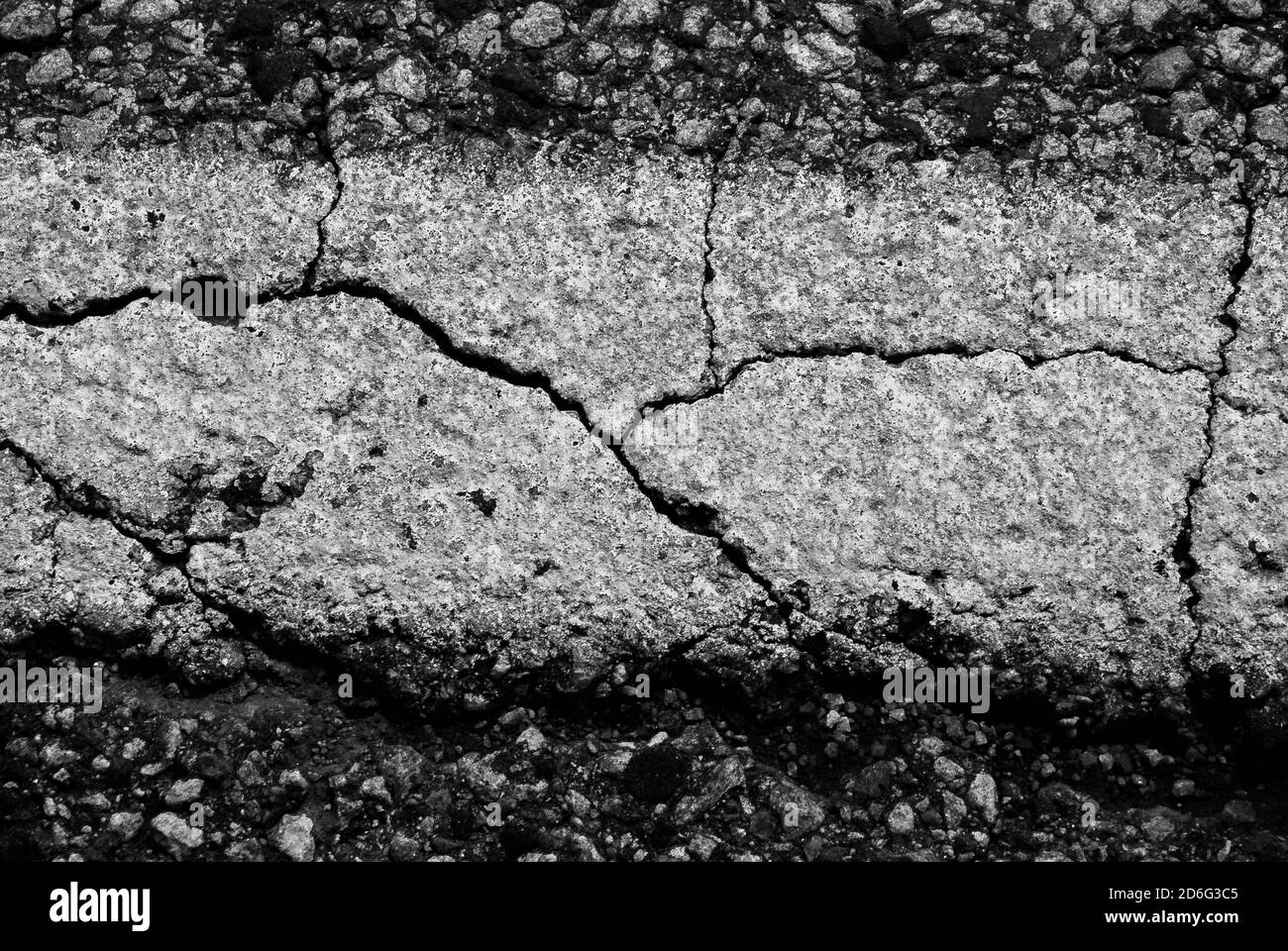 Closeup of a cracked asphalt texture Stock Photo - Alamy