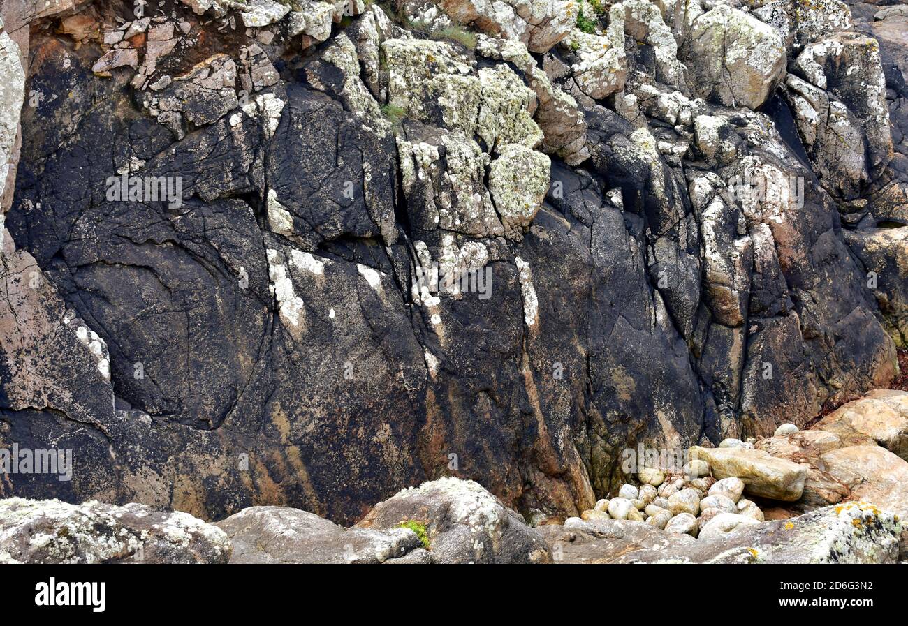 Rocks with oil spill from the sinking of oil tanker MV Prestige in 2002 ...