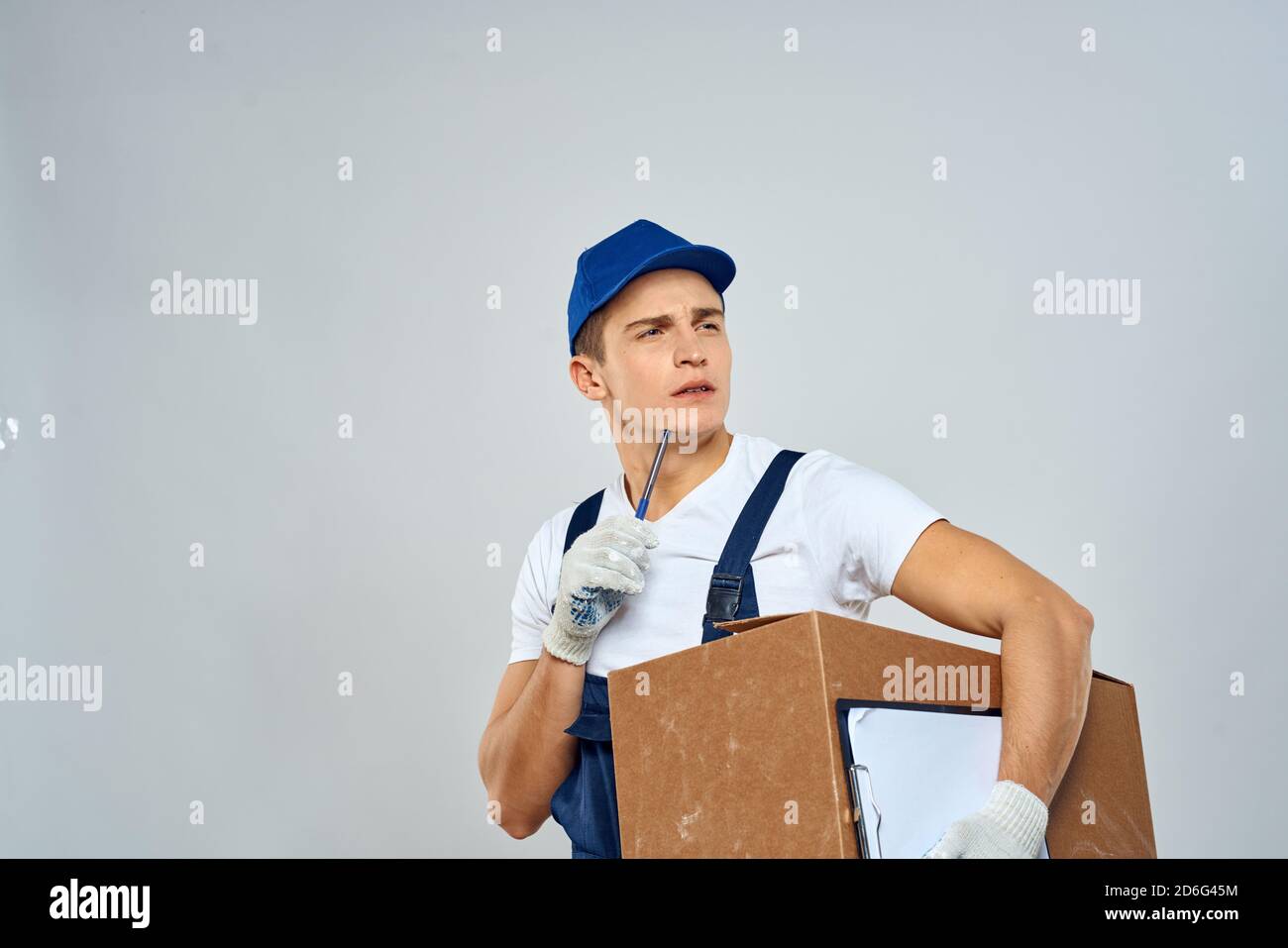 Man worker with box in hands delivery loading service packing service ...