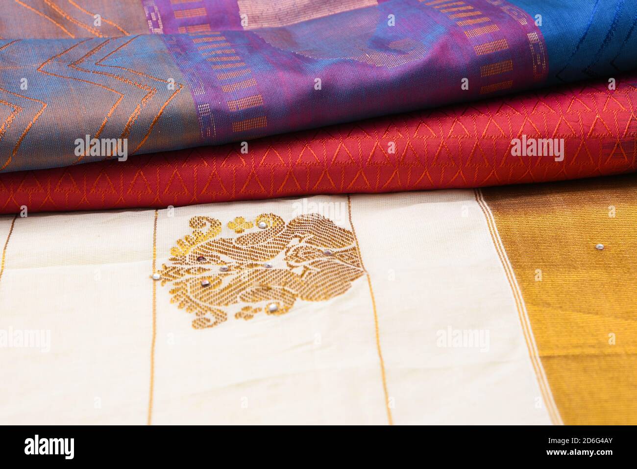 Indian silk sari, handmade white Kerala Sari, woman wearing holding ...