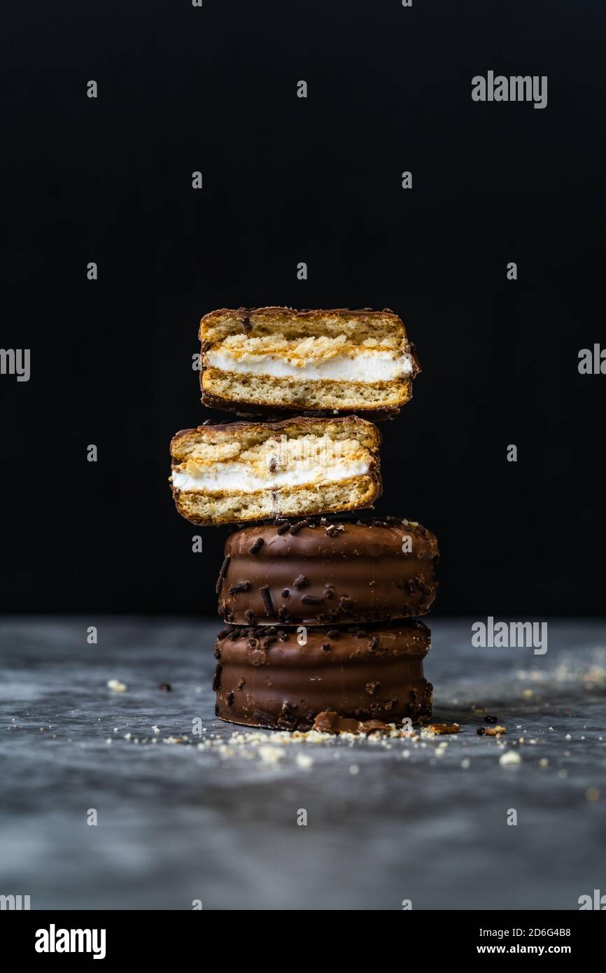 Traditional Alfajores (Alfajor) with dulce de leche covered with ...
