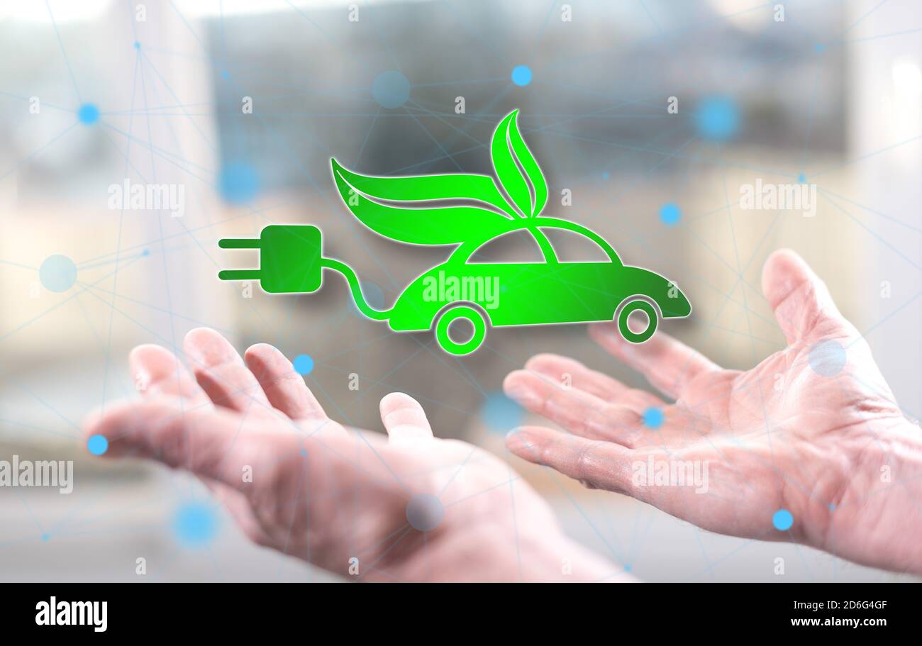Eco friendly car concept above the hands of a man Stock Photo - Alamy