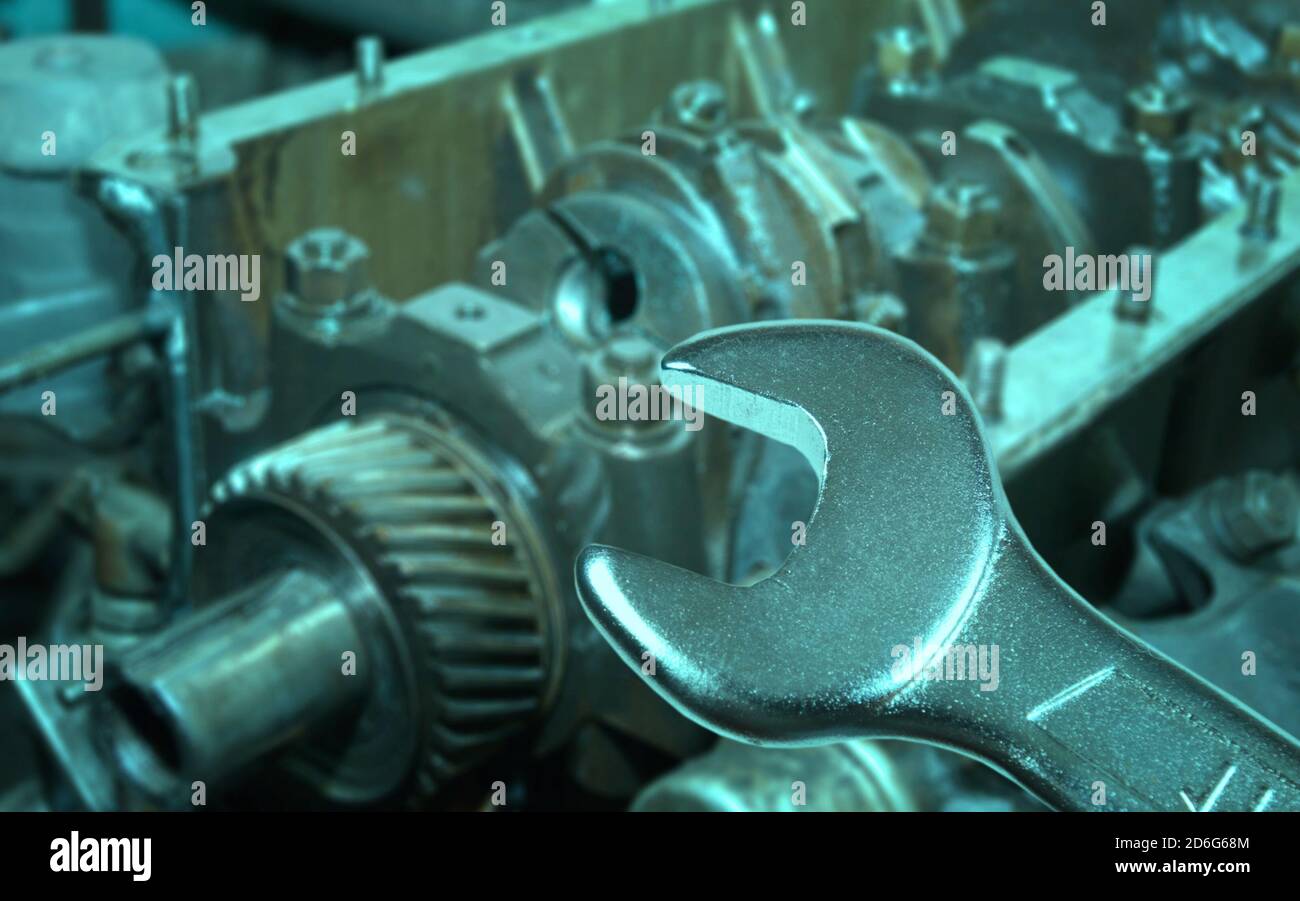 car engine and spanner. Focus on spanner.Working on a Car Stock Photo ...