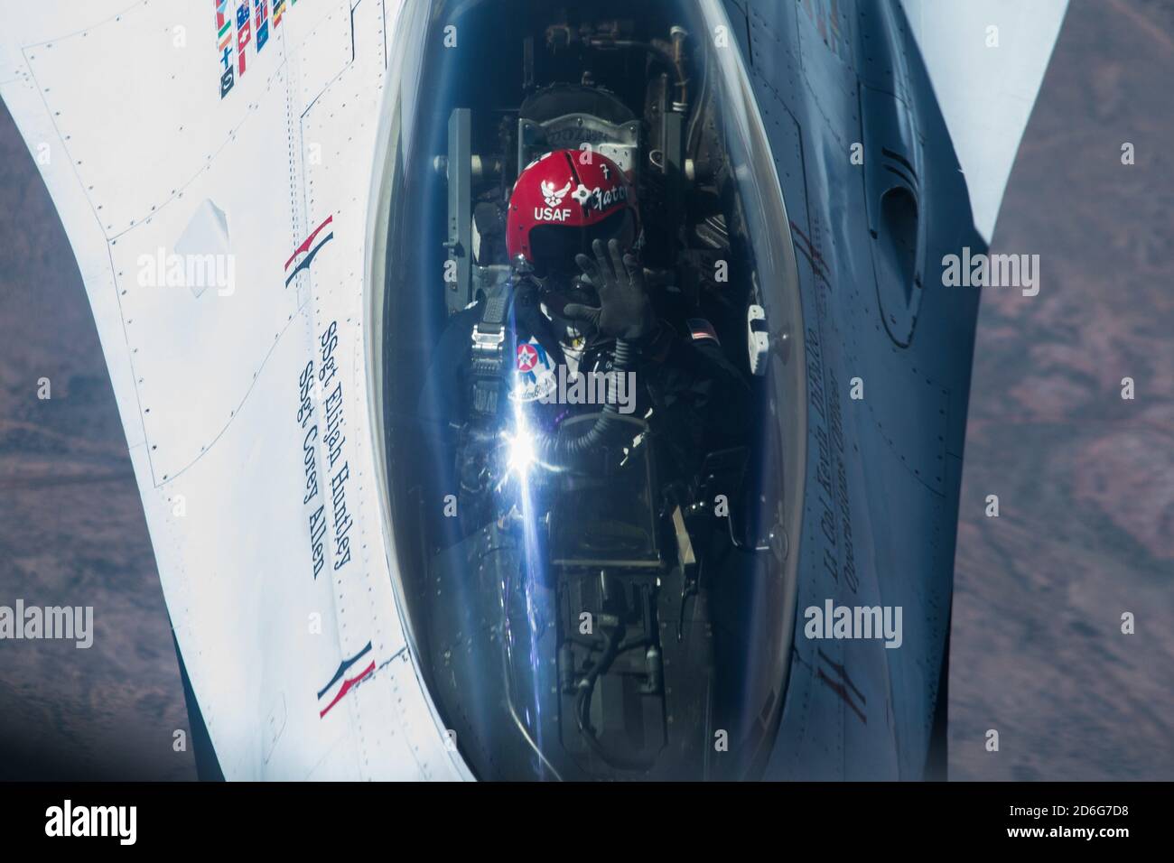A pilot of an F-16 Fighting Falcon Thunderbird waves to Tech. Sgt ...