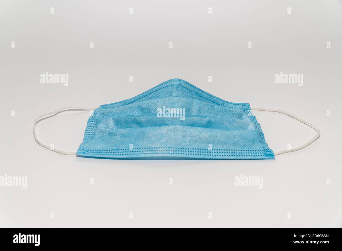 Blue worn face mask isolated on a white background - the new normal ...