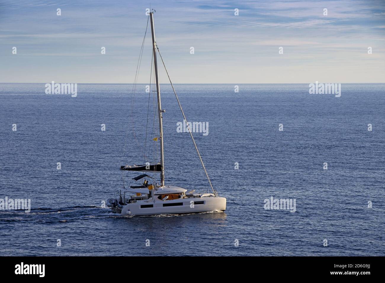 Small Sailing boat yacht in the open blue Sea Stock Photo - Alamy