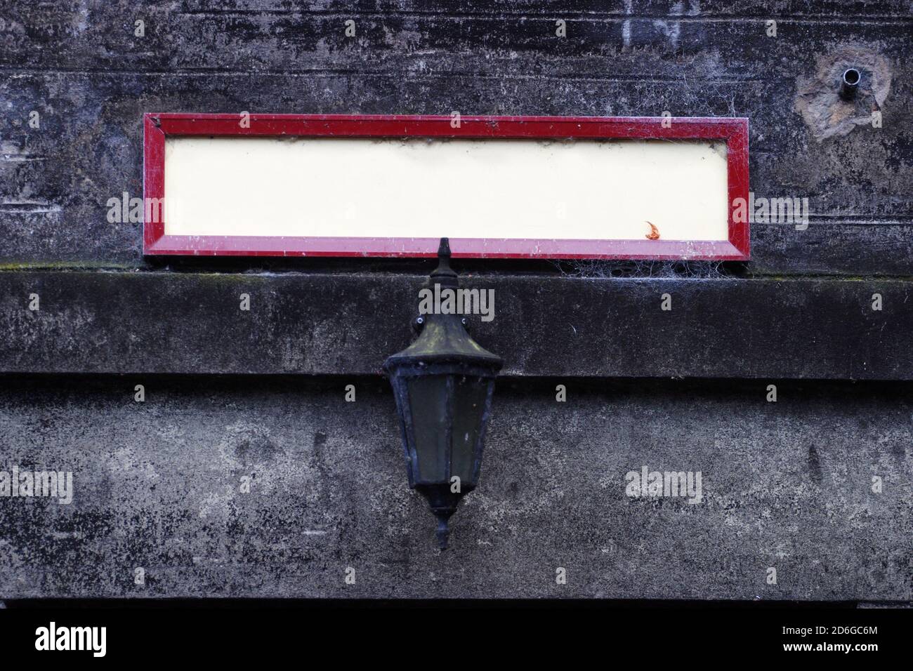 empty sign on stone wall Stock Photo - Alamy