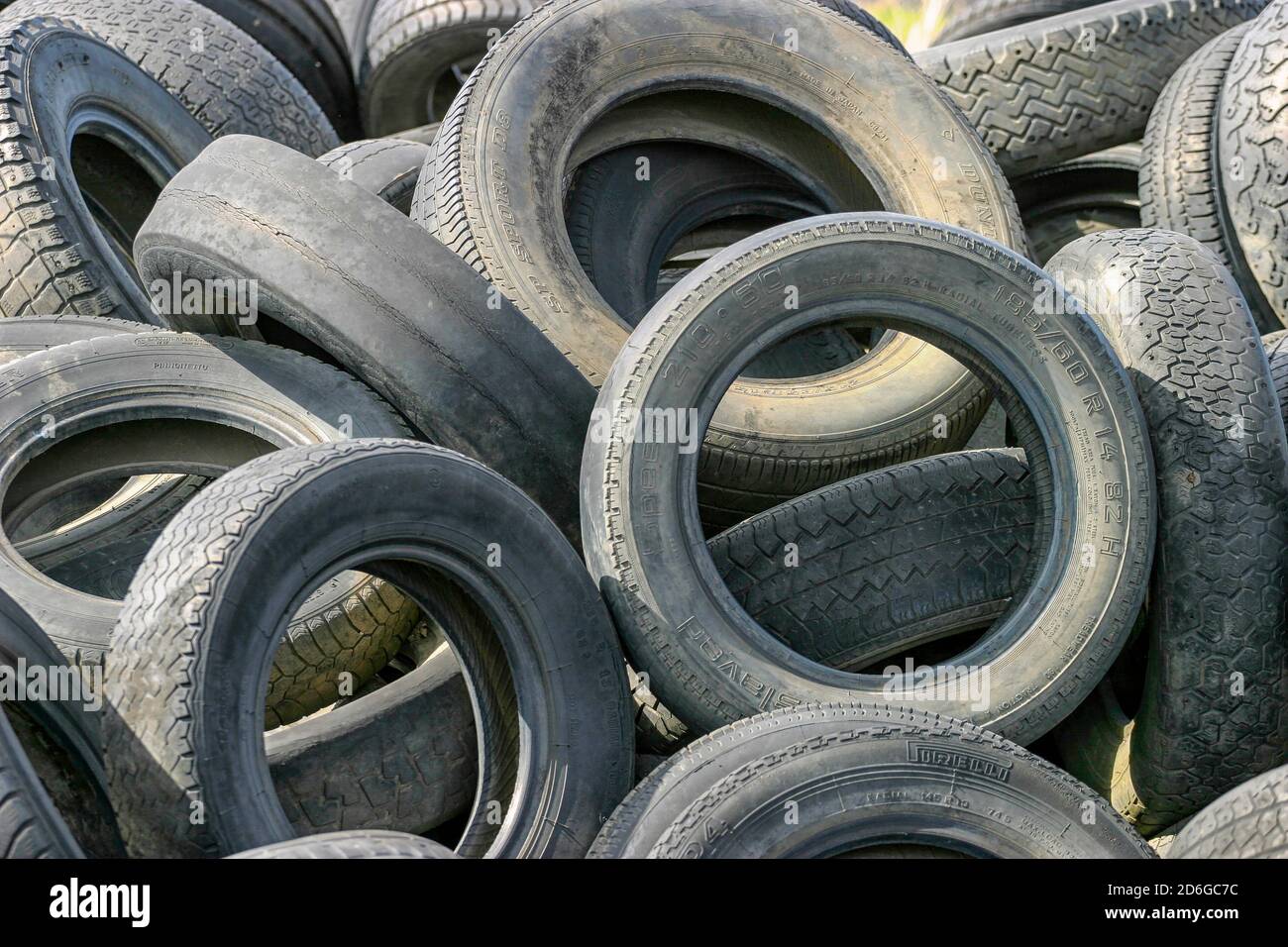 Old tires collected for recycling Stock Photo - Alamy