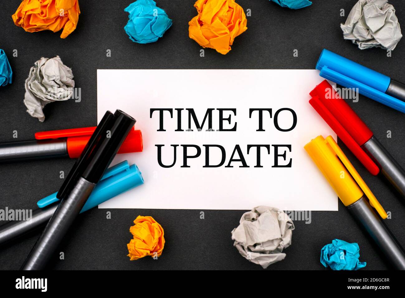 Paper blank with words Time to Update, colour pens and crumpled paper ...