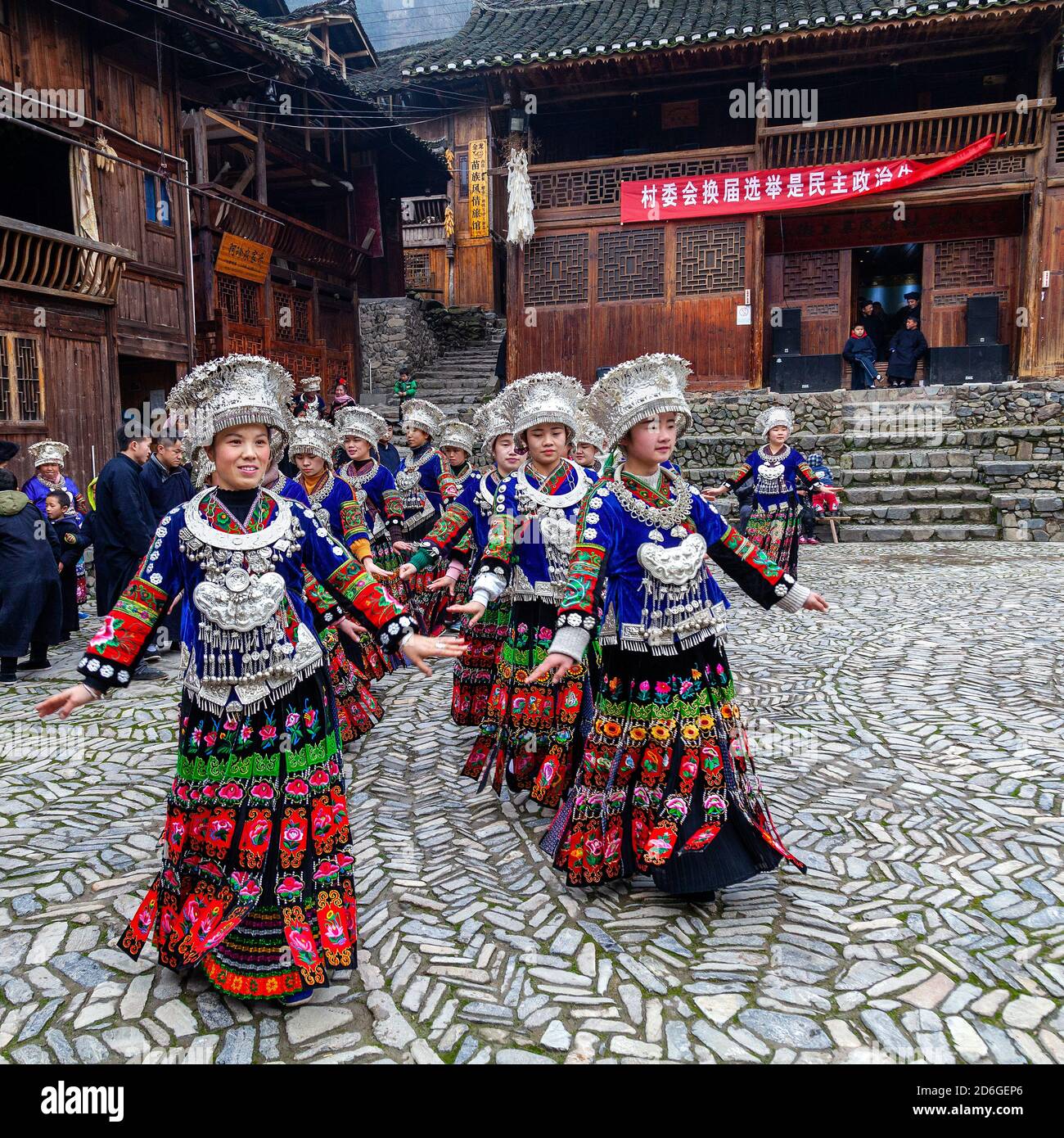 Young girls performing a traditional dance. They are of the Longde long ...