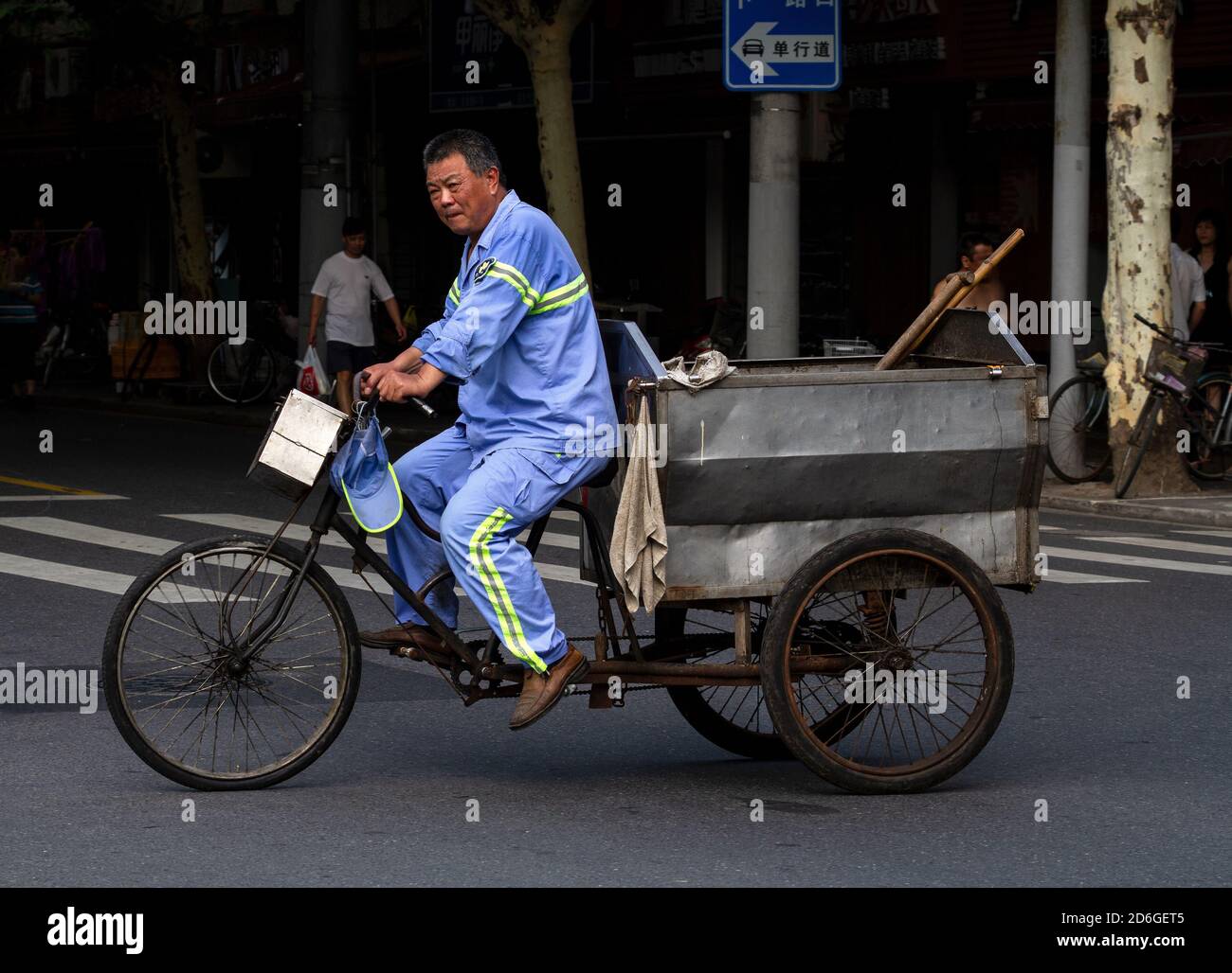 Traditional work tricycle, Shanghai, China. A waste collector in his ...