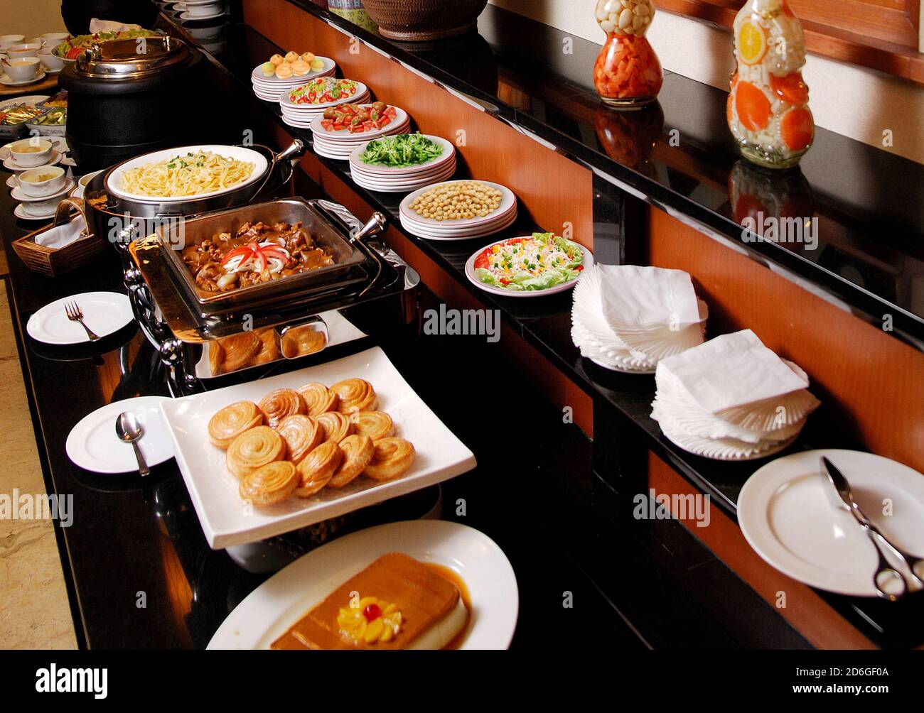 Buffet table with assorted delicious food and fresh vegetables salad ...