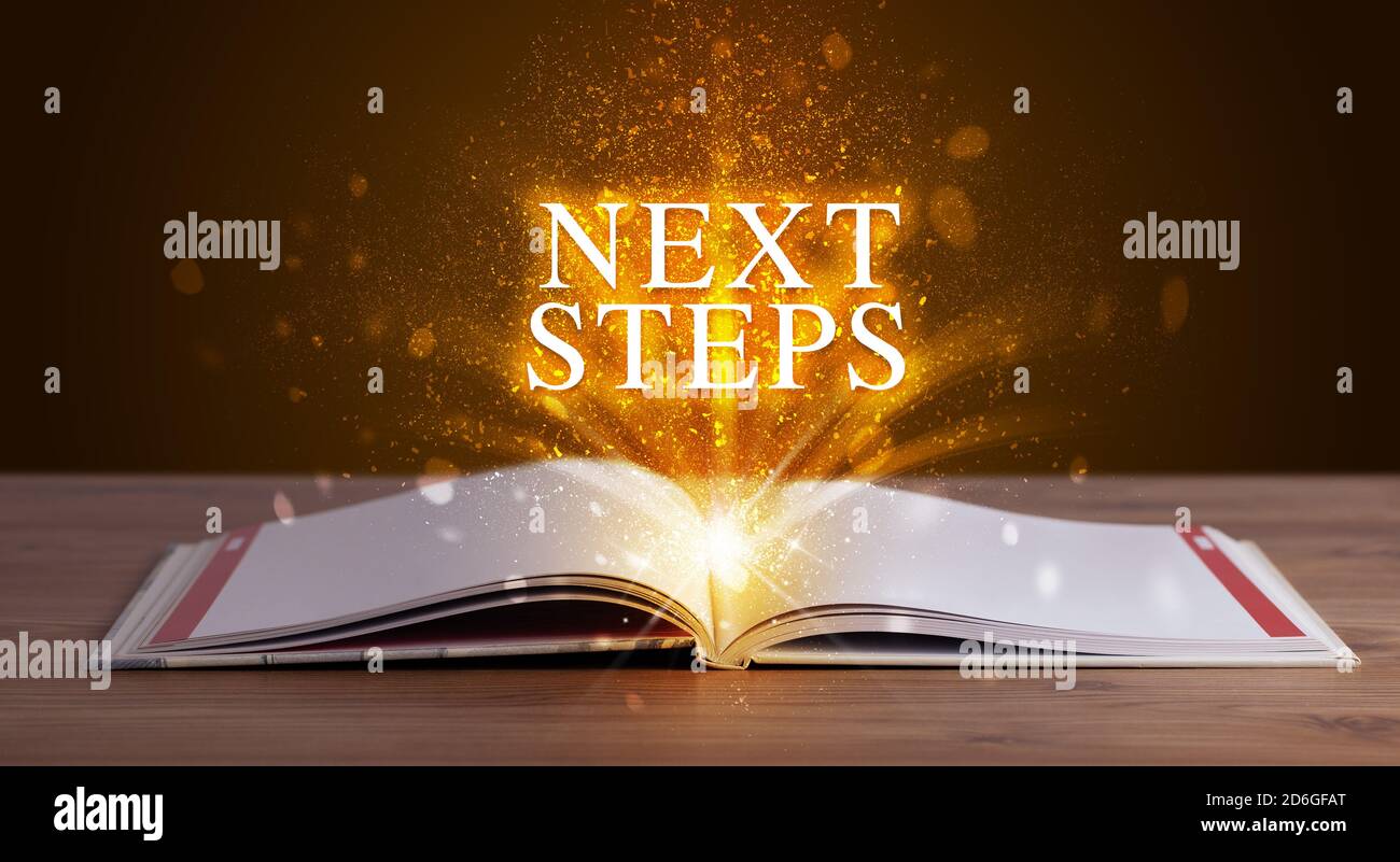 NEXT STEPS inscription coming out from an open book, educational ...