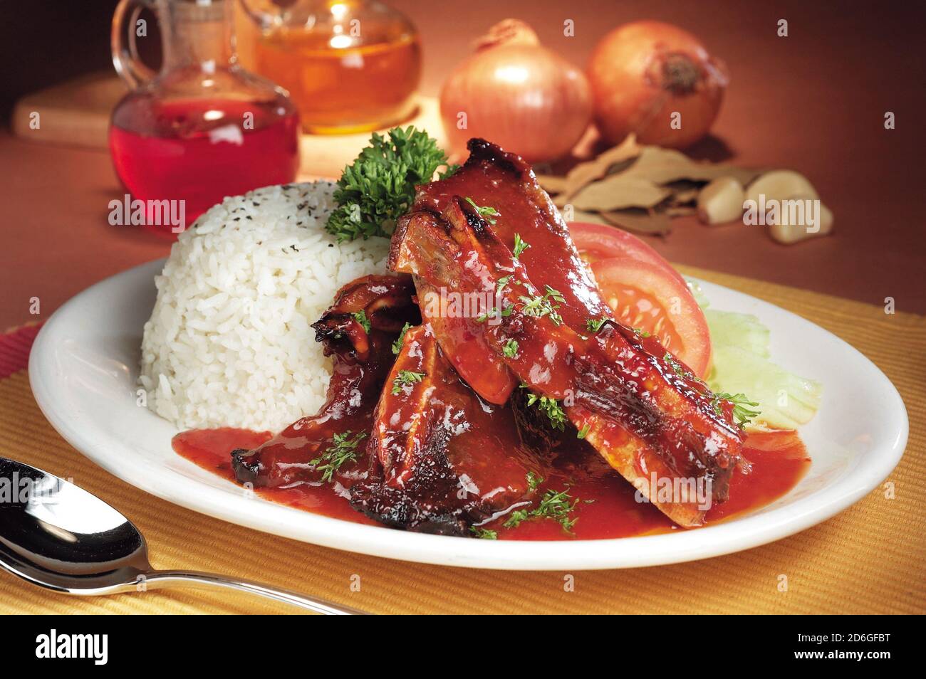 Braised beef ribs with red sauce and rice Stock Photo - Alamy