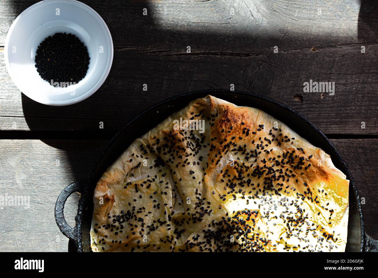 Nigella sativa also known as black cumin. Bread covered with black ...