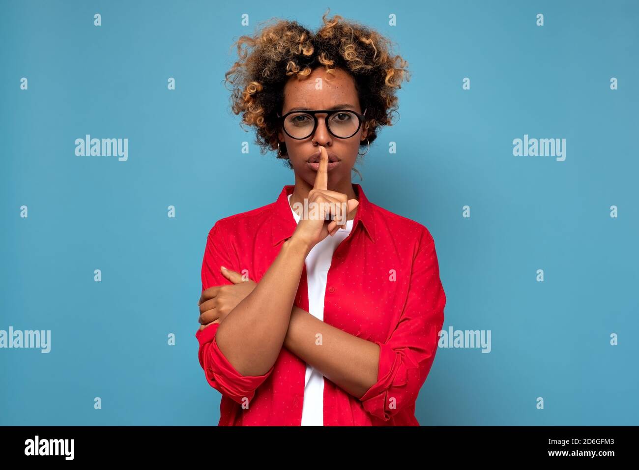 Pretty african woman makes shush, asks not be loud, has secret ...