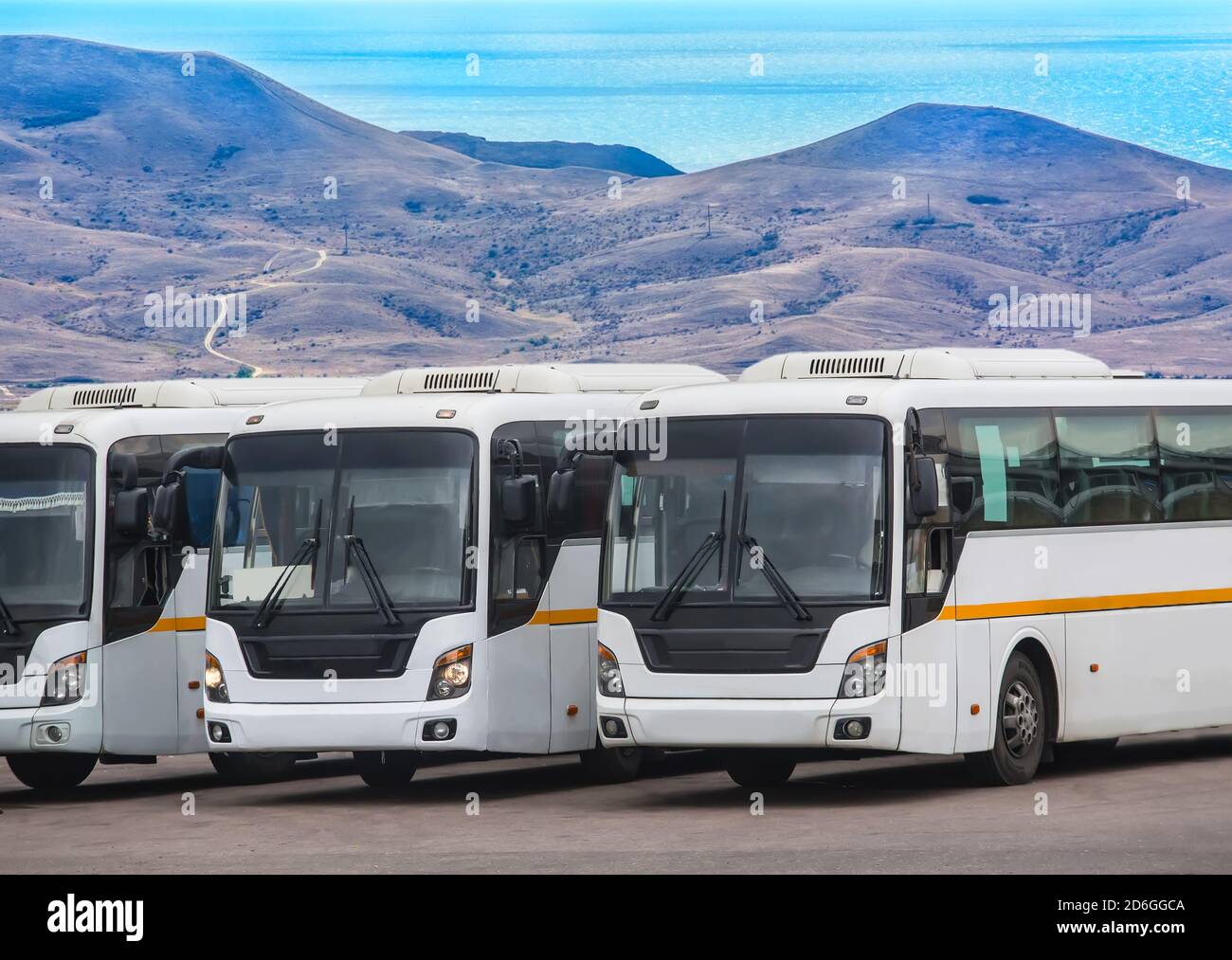 Tour Buses in the Parking lot in the mountains Stock Photo - Alamy