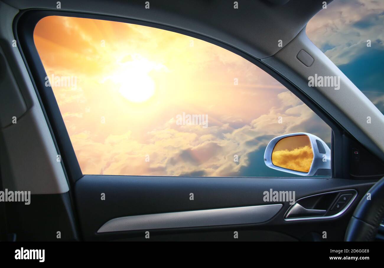 Heavenly landscape behind car window Stock Photo - Alamy