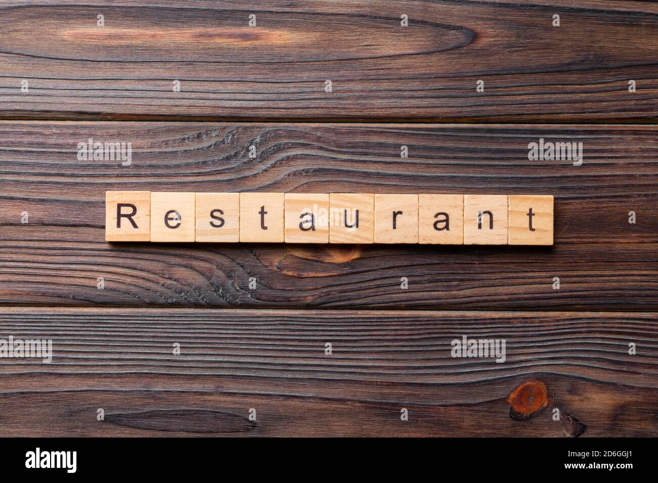 Restaurant word written on wood block. Restaurant text on cement table ...