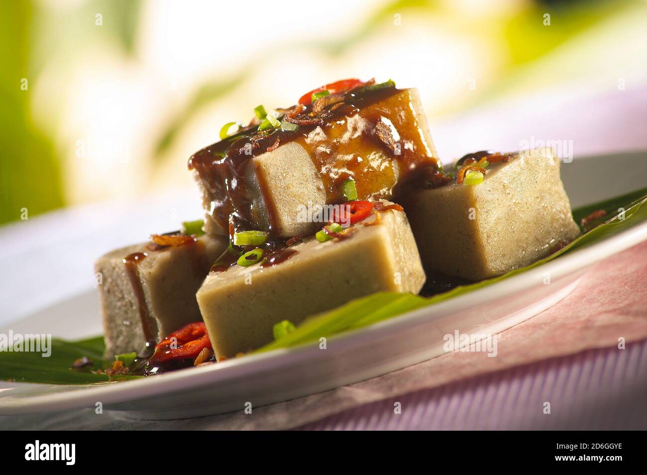 Yam cake dessert with sweet soy sauce Stock Photo - Alamy