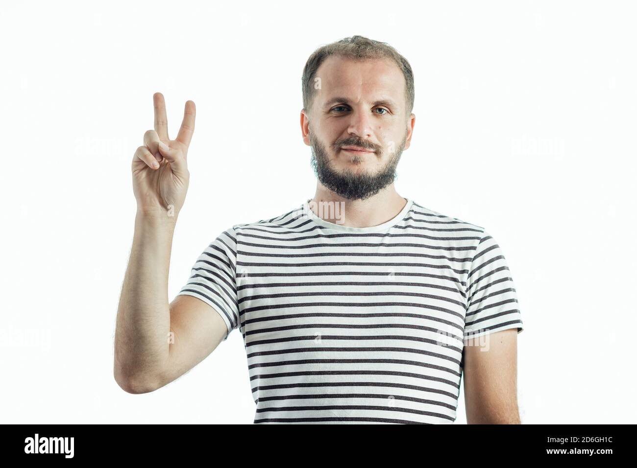 Victory sign positive young man hi-res stock photography and images - Alamy