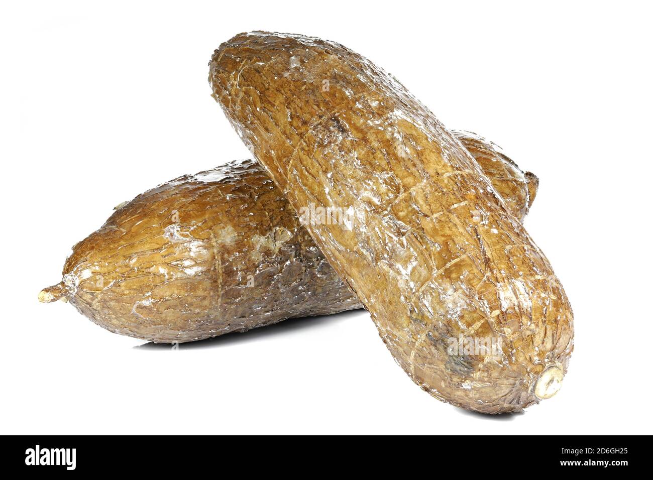 cassava tubers isolated on white background Stock Photo - Alamy