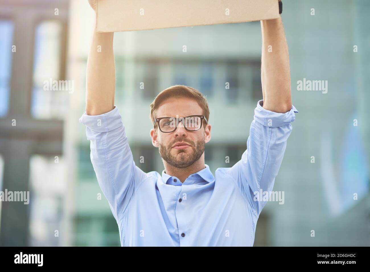 Portrait of a young caucasian man, male activist wearing blue shirt and ...