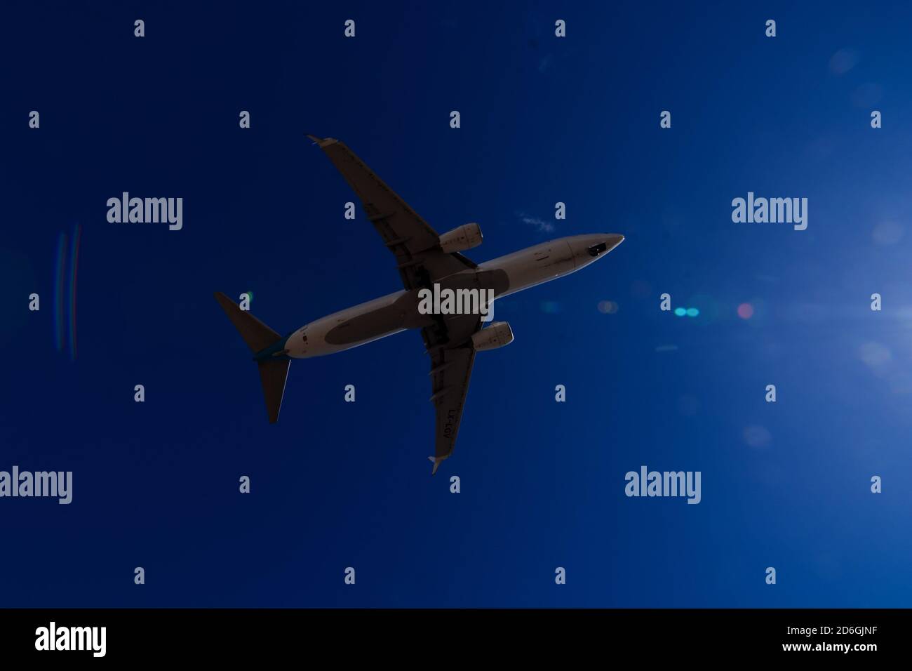 Silhouette airplane flying Stock Photo - Alamy