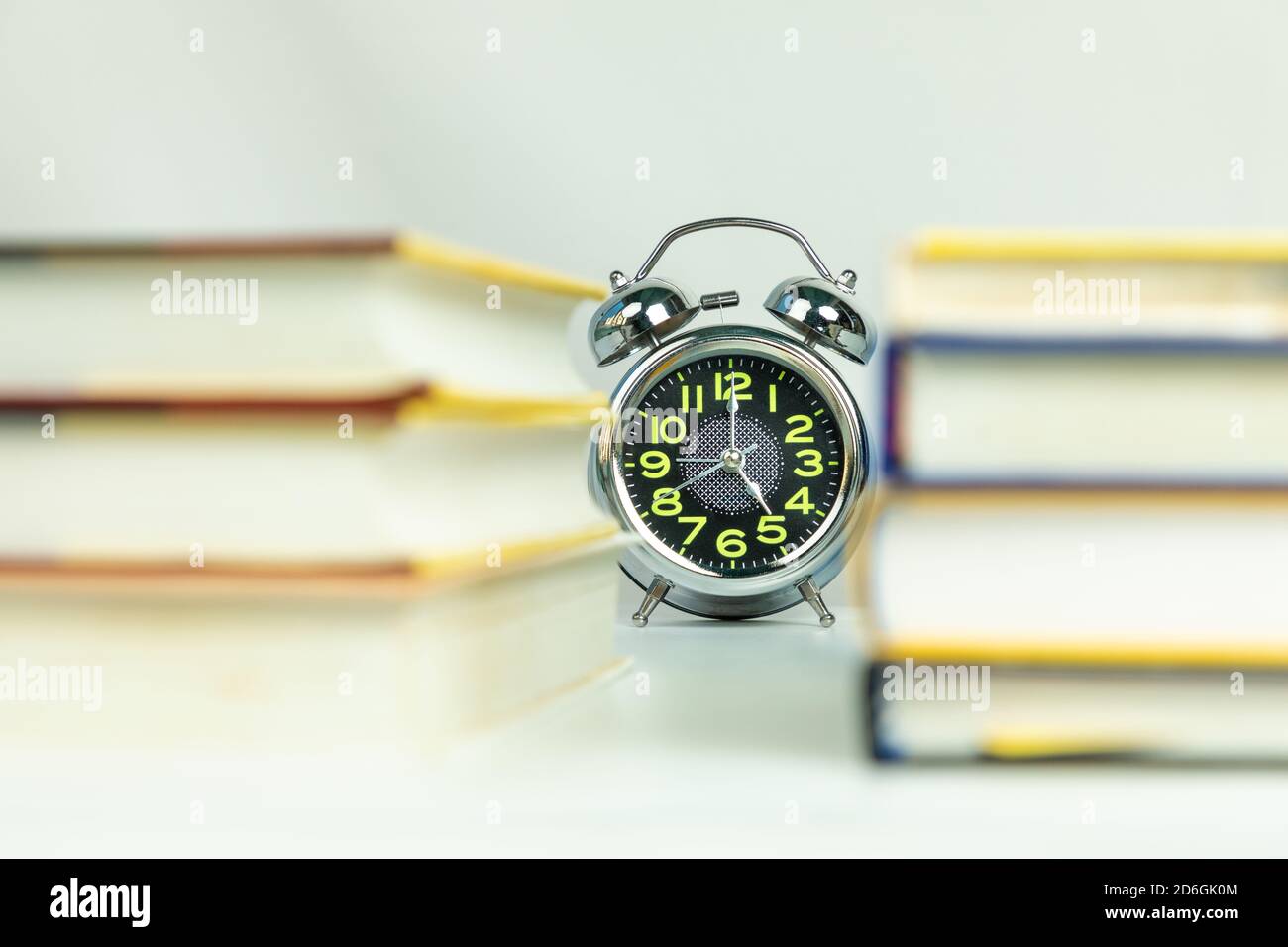Clock through books hi-res stock photography and images - Alamy
