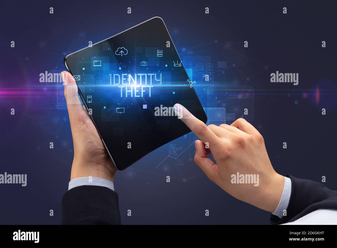 Businessman holding a foldable smartphone with IDENTITY THEFT ...