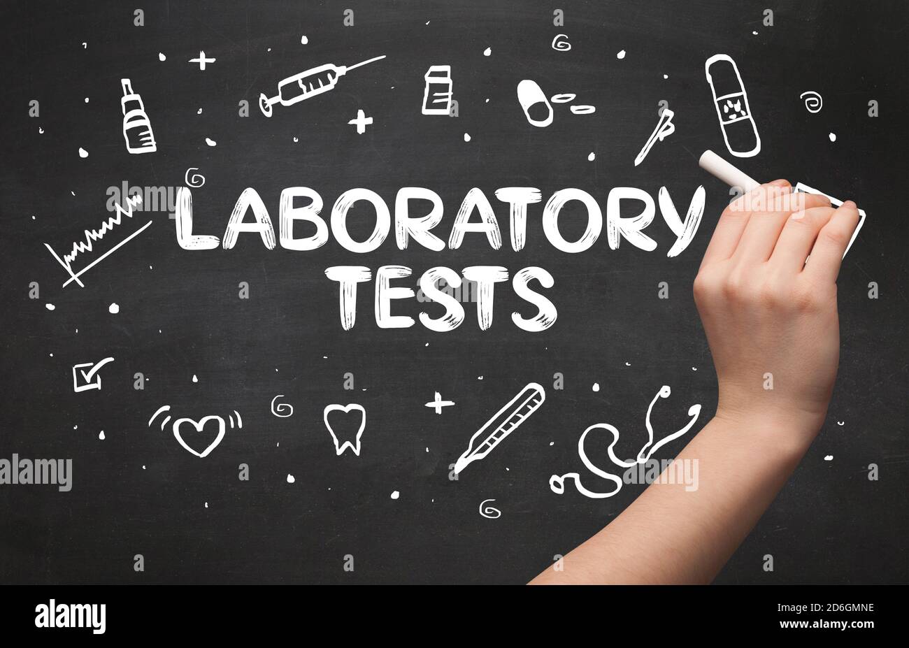 Hand drawing LABORATORY TESTS inscription with white chalk on ...