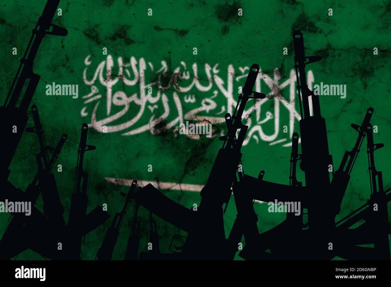 Several automatic rifles raised up on the background of the Saudi ...