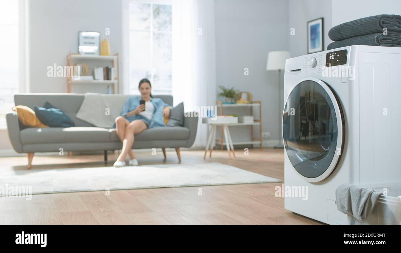Shot of a Modern Technologically Advanced Washing Machine Working in a ...