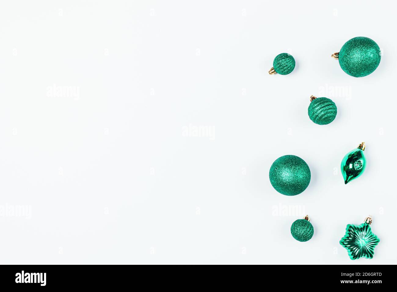 Minimal flat lay composition with green Christmas tree decorations on ...