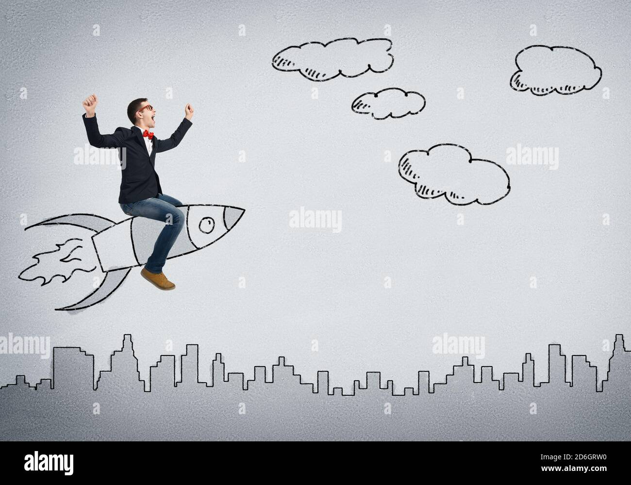 Man ride rocket Stock Photo - Alamy